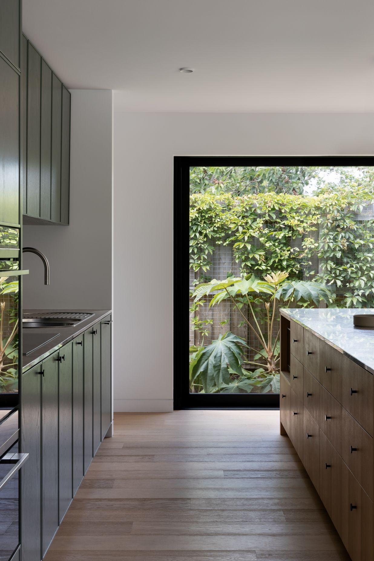 Clad in spotted gum, this rustic addition offers a serene and low ...