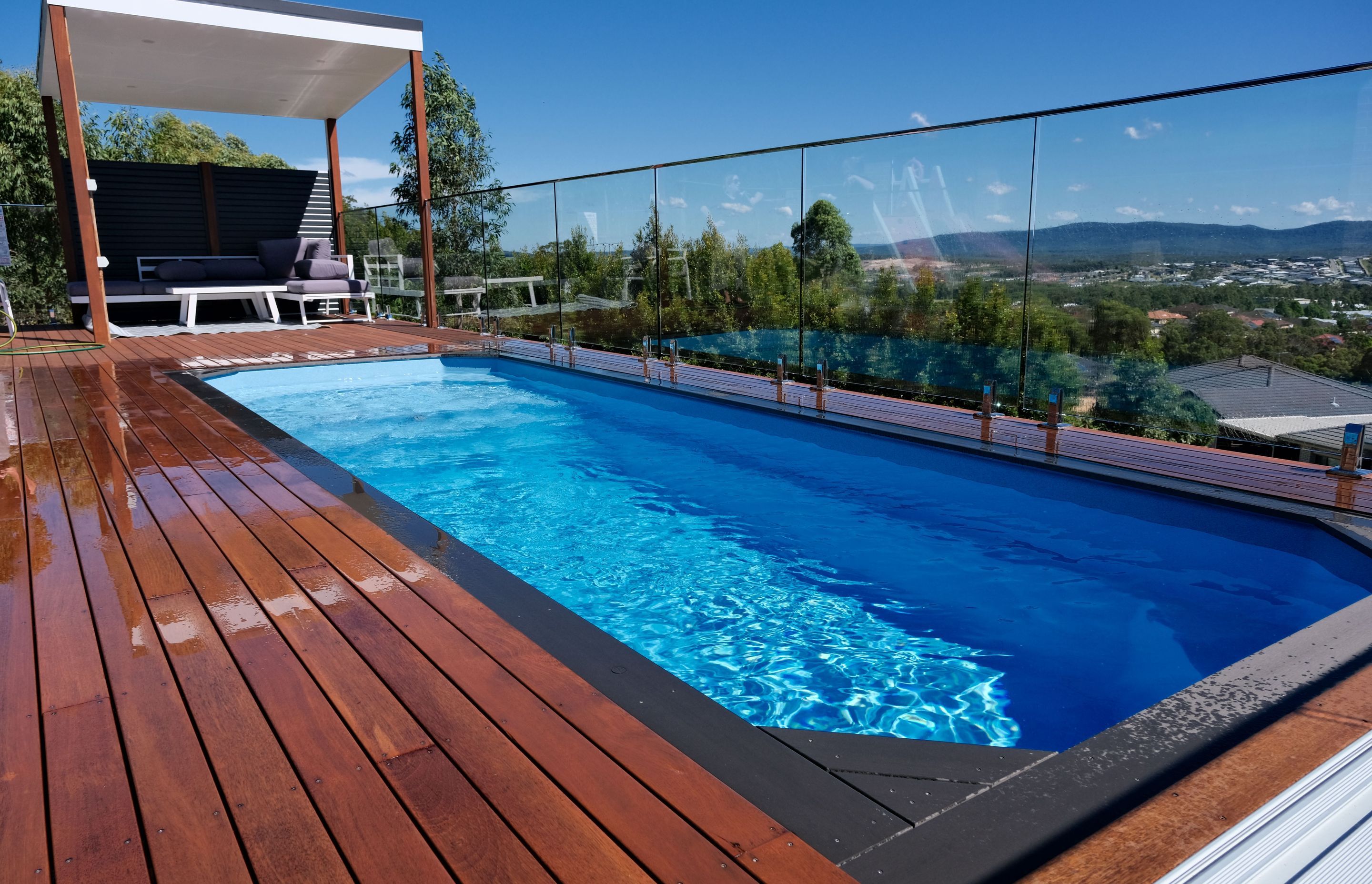 Elevate a sloping site with a compact pool and alfresco leisure zone