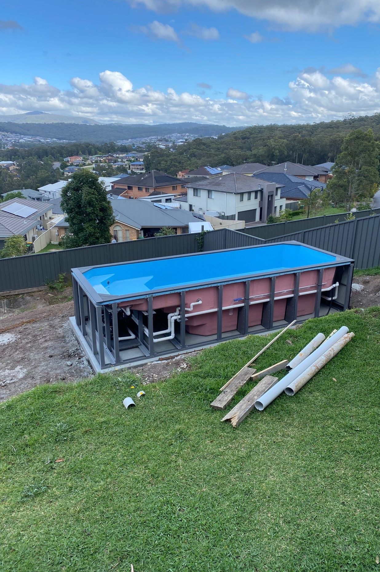 Elevate a sloping site with a compact pool and alfresco leisure zone