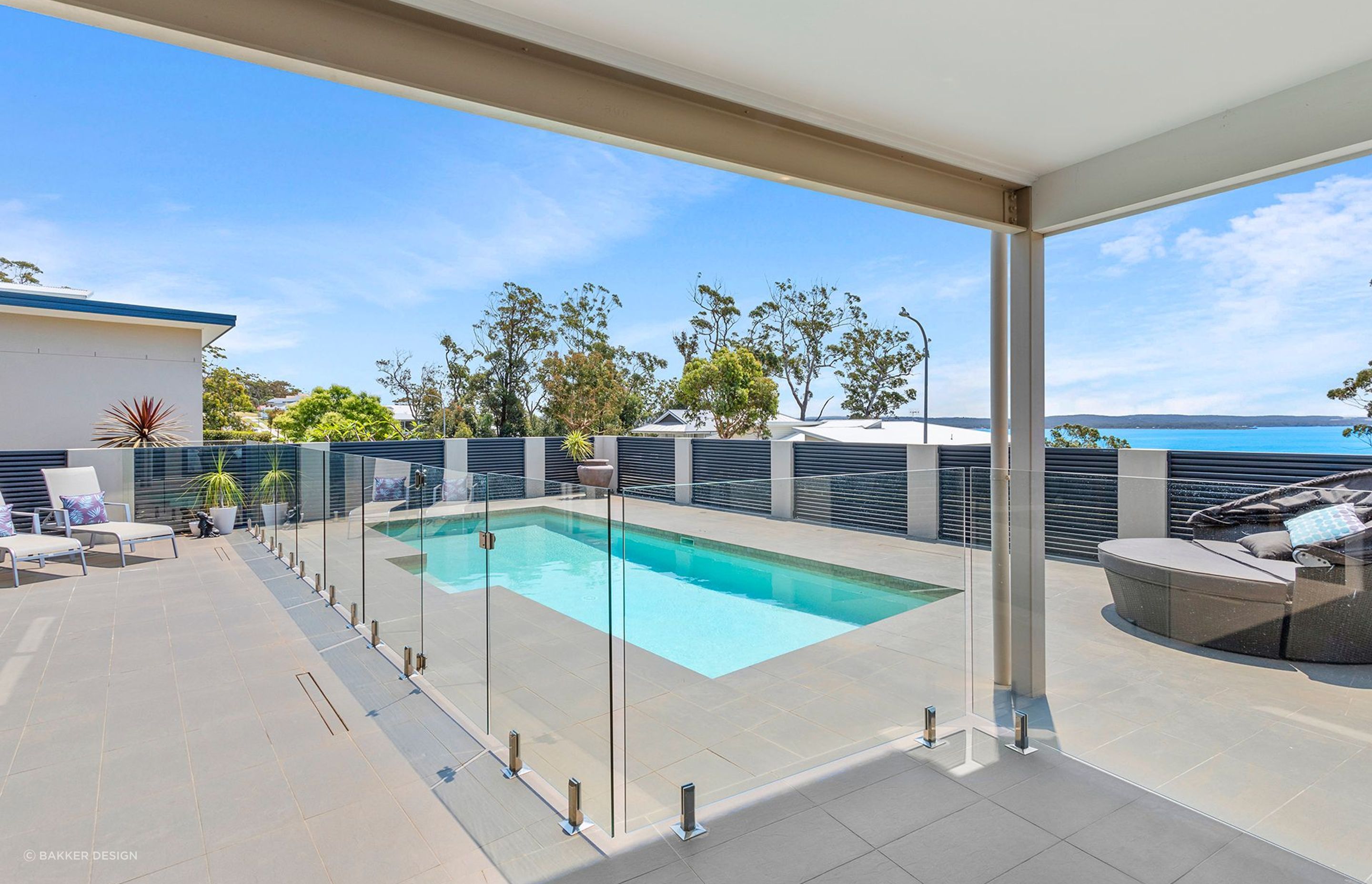 Two storey home overlook pool by Bakker Design | ArchiPro AU