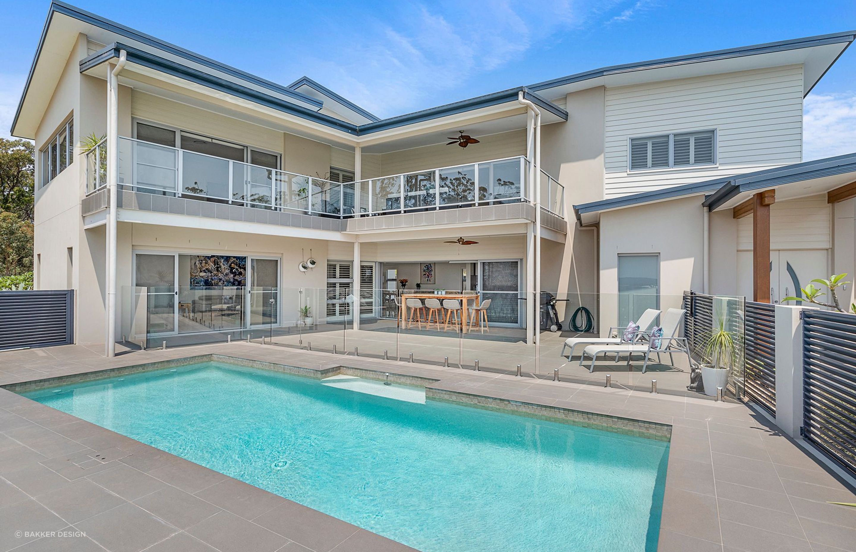 Two storey home overlook pool by Bakker Design | ArchiPro AU