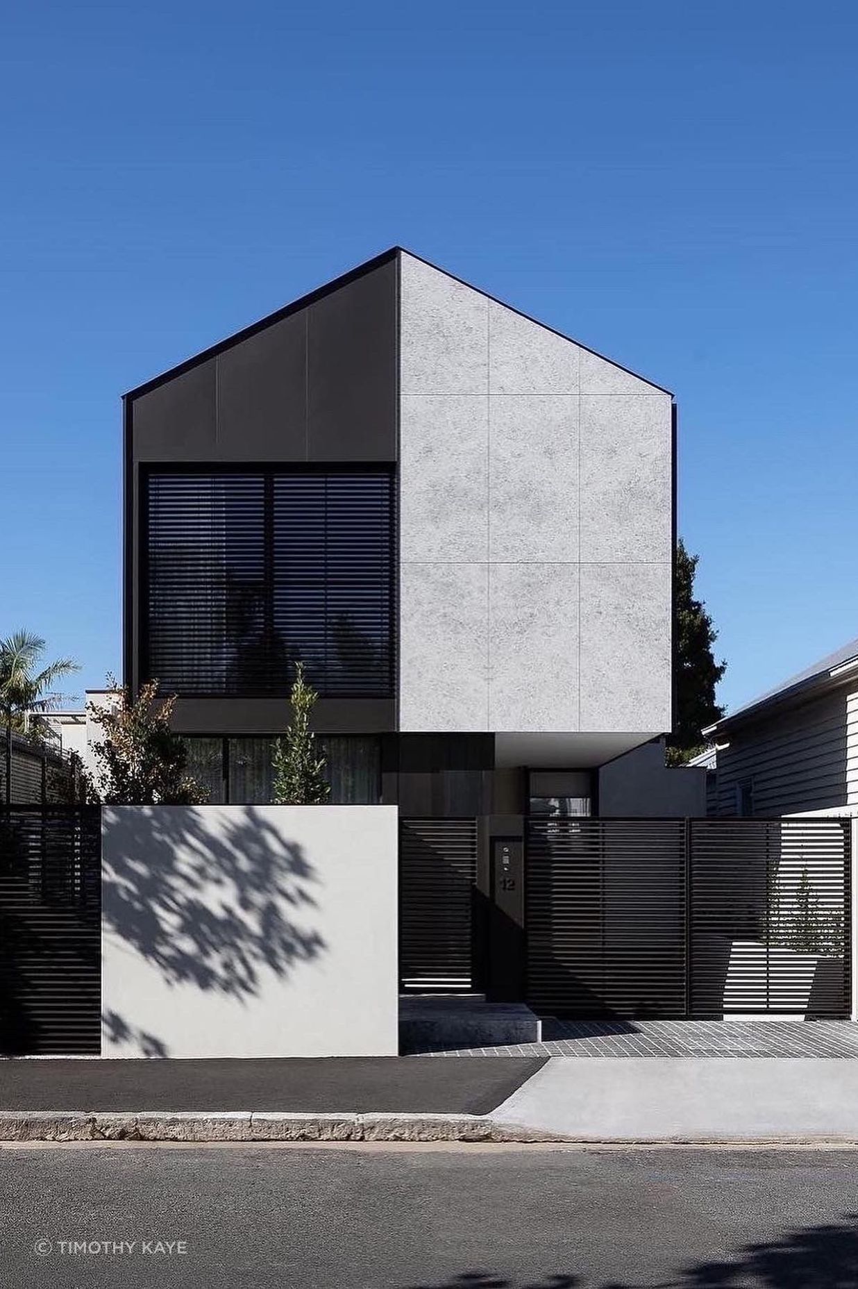 House of Bronzed Steel and Stone by Anderson Construction | ArchiPro AU
