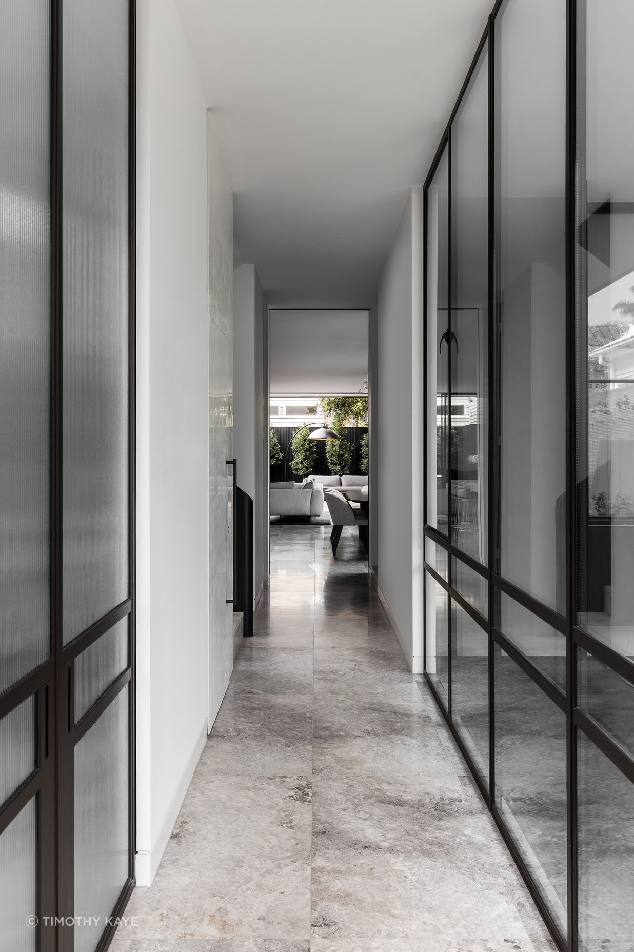 House of Bronzed Steel and Stone by Anderson Construction | ArchiPro AU
