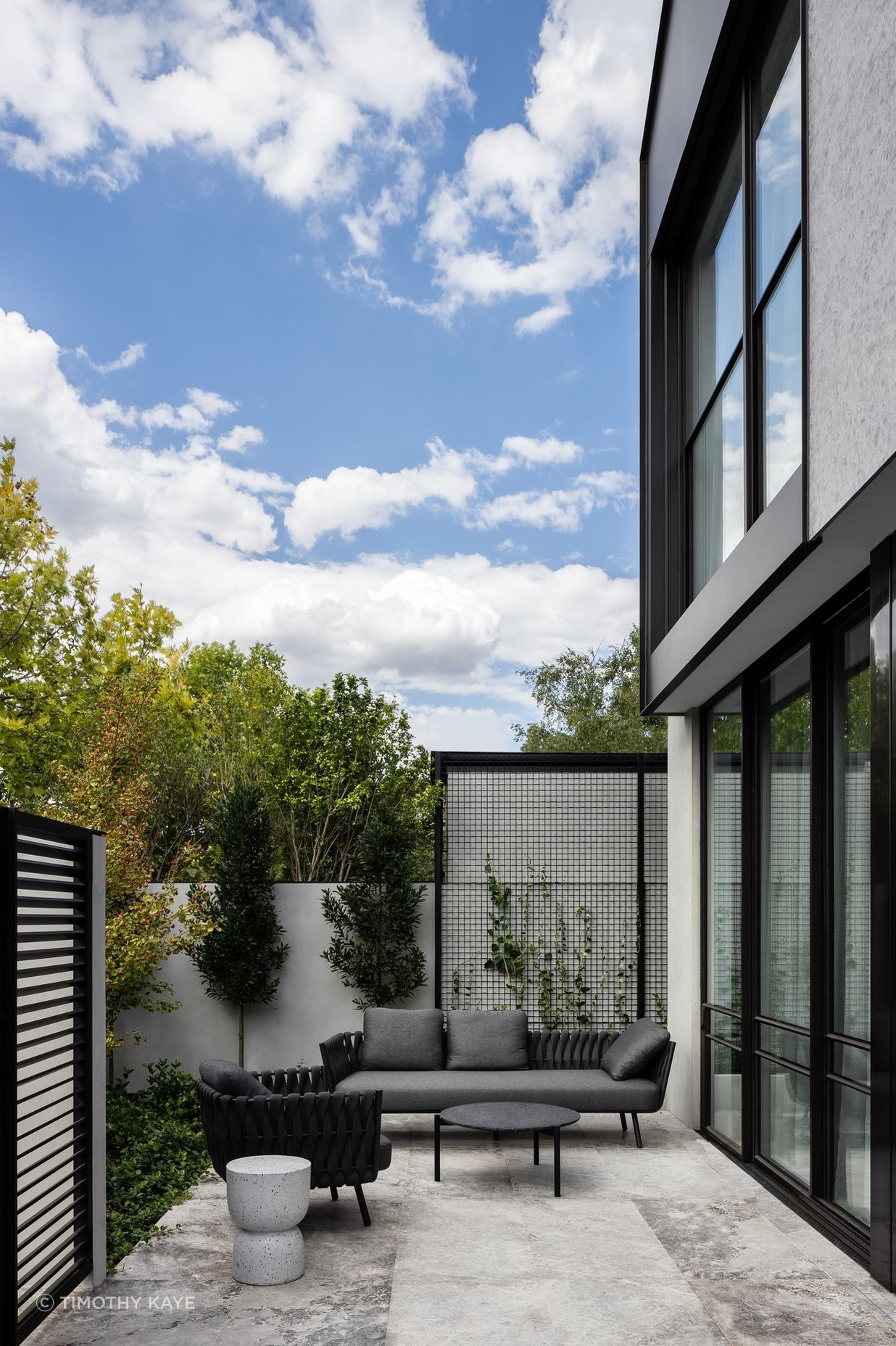 House of Bronzed Steel and Stone by Anderson Construction | ArchiPro AU