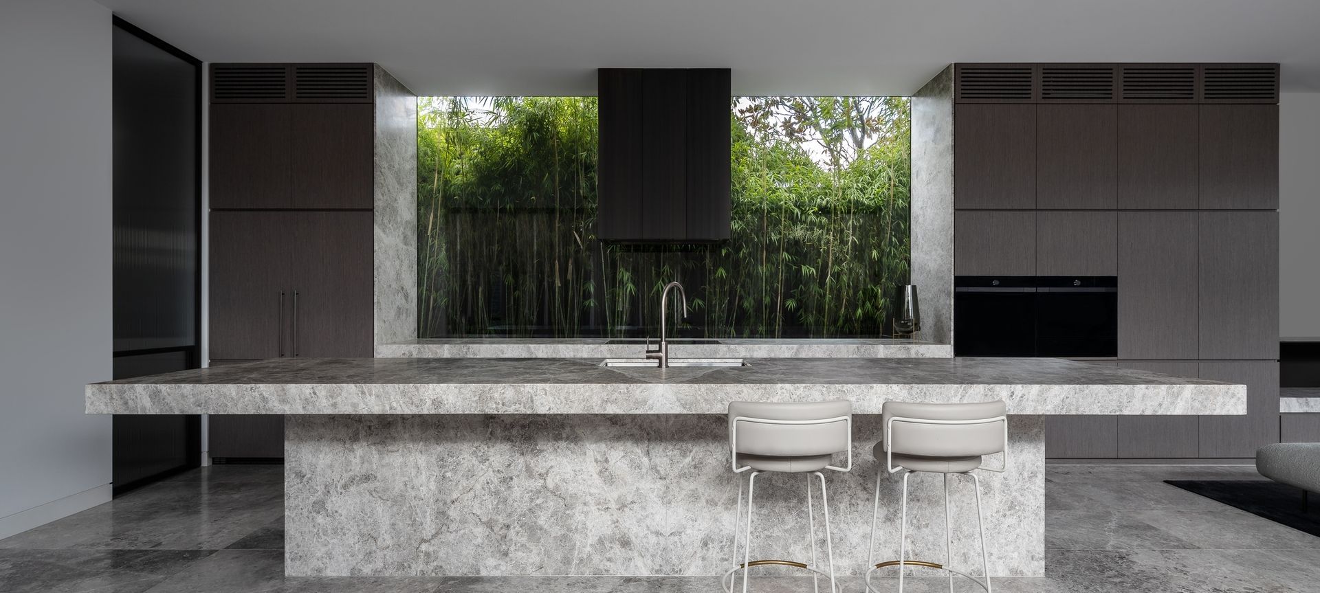 House of Bronzed Steel and Stone by Anderson Construction | ArchiPro AU