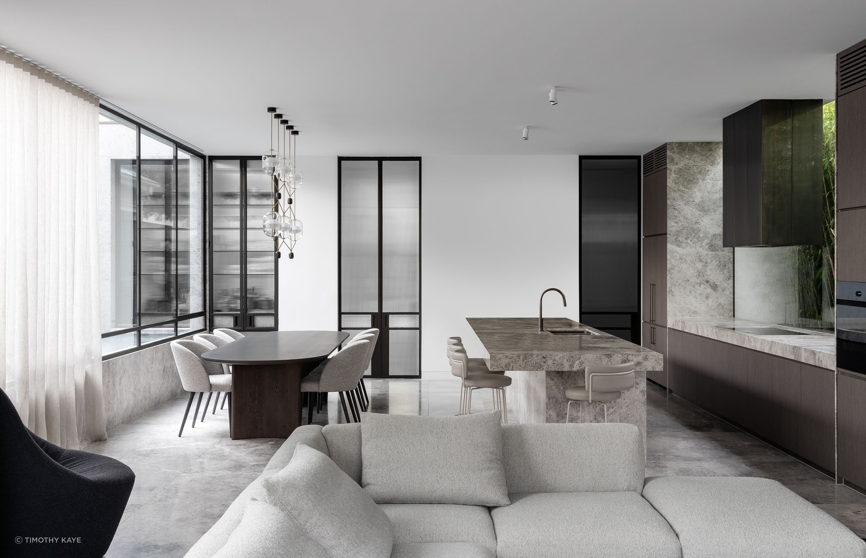 House of Bronzed Steel and Stone by Anderson Construction | ArchiPro AU