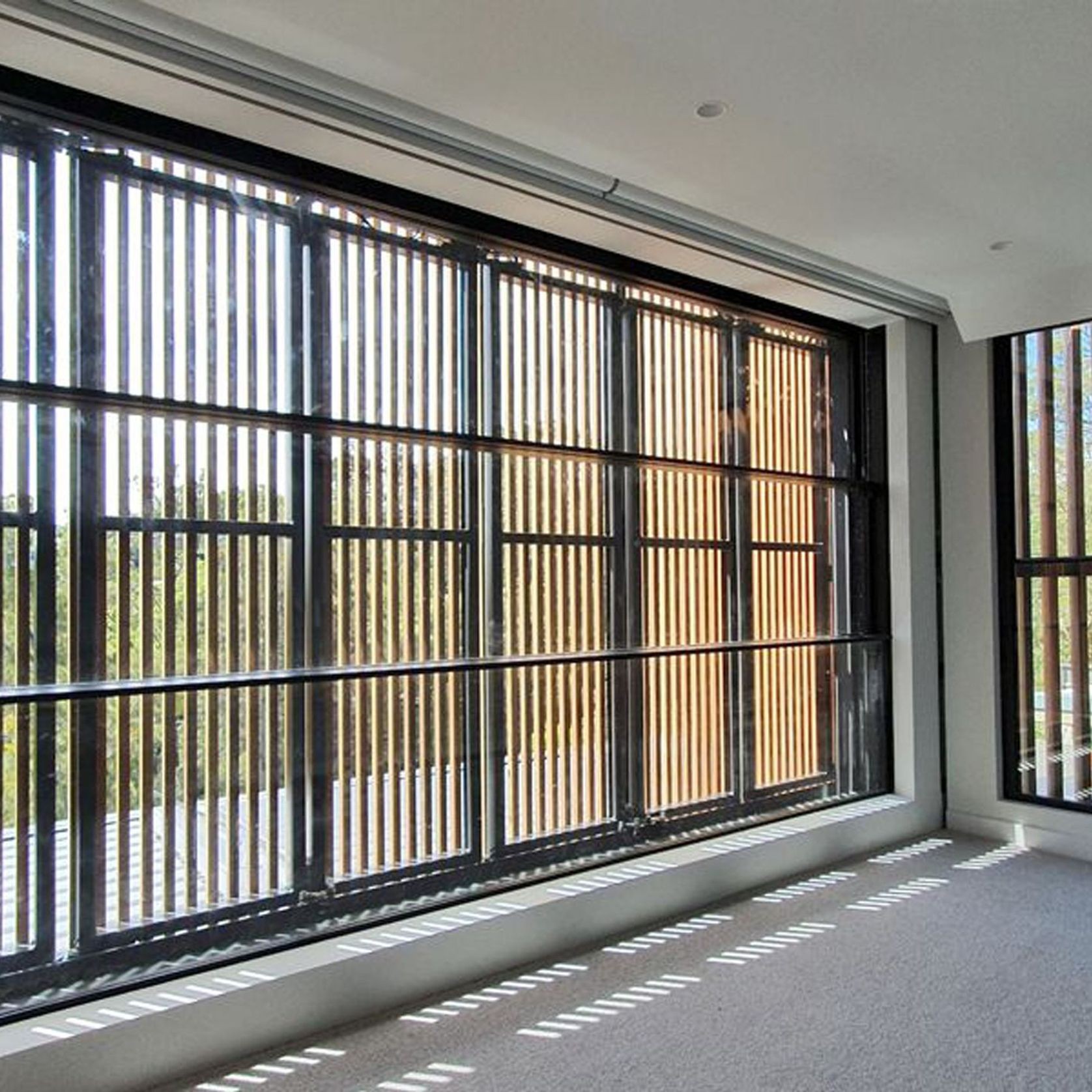 Motorised Vertical Bi-Fold Screens | ADI | ArchiPro AU