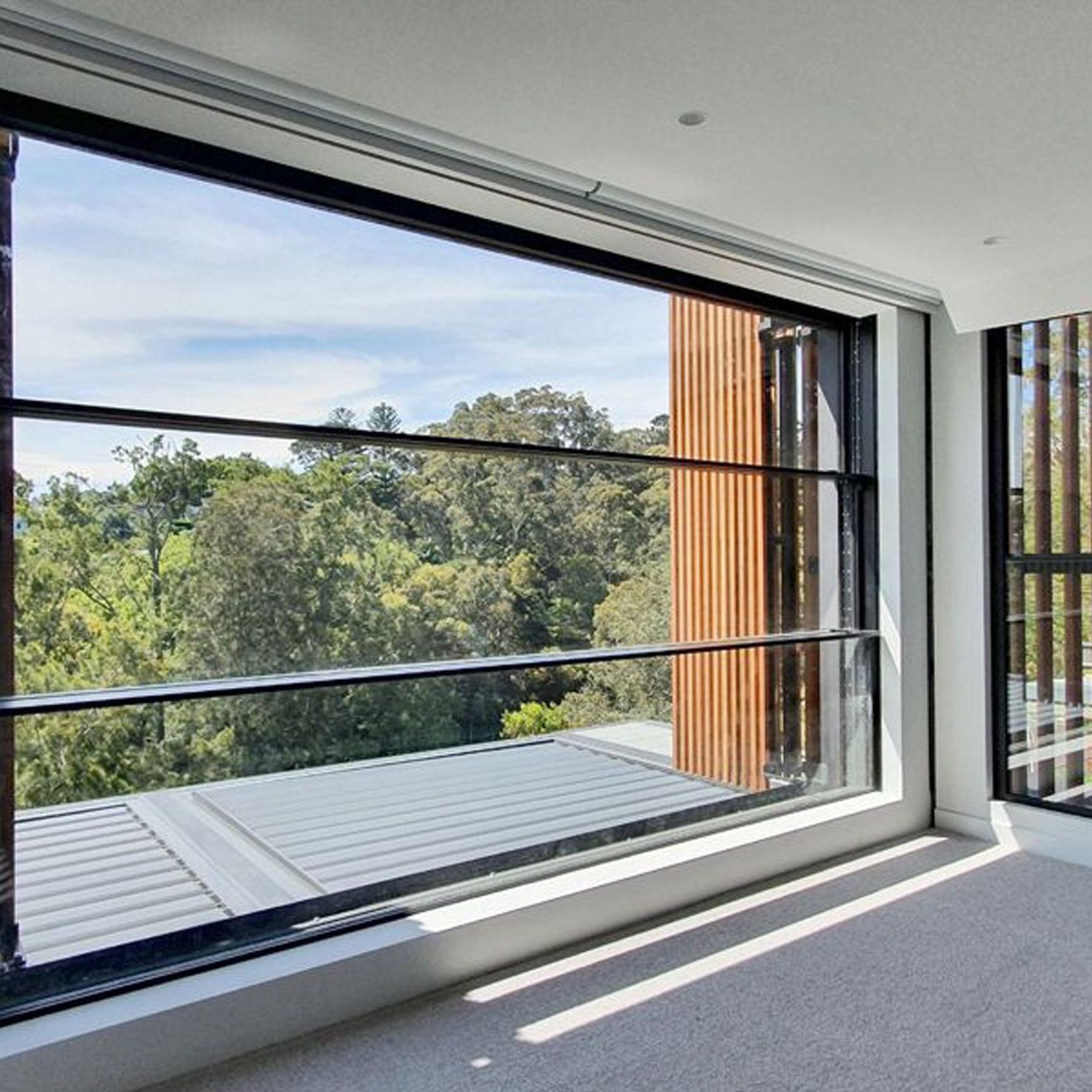 Motorised Vertical Bi-Fold Screens | ADI | ArchiPro AU