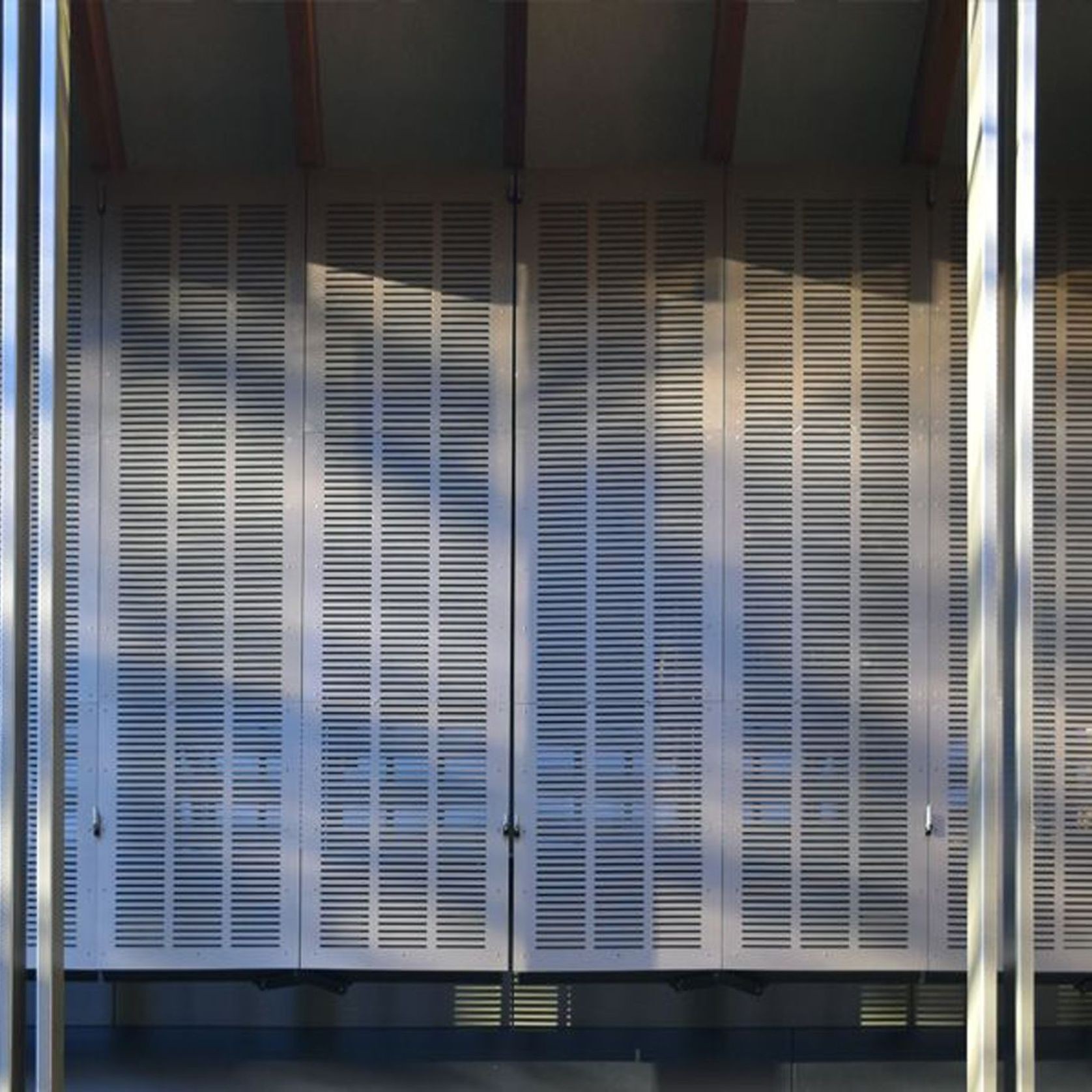 Motorised Vertical Bi-Fold Screens | ADI | ArchiPro AU