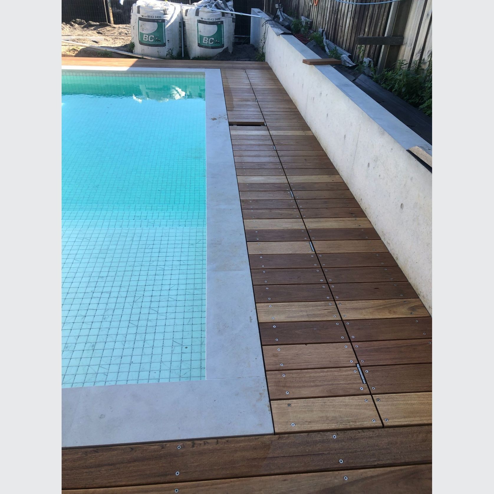 Under Deck UnderCover® Concealed Pool Cover - Powered | ArchiPro AU