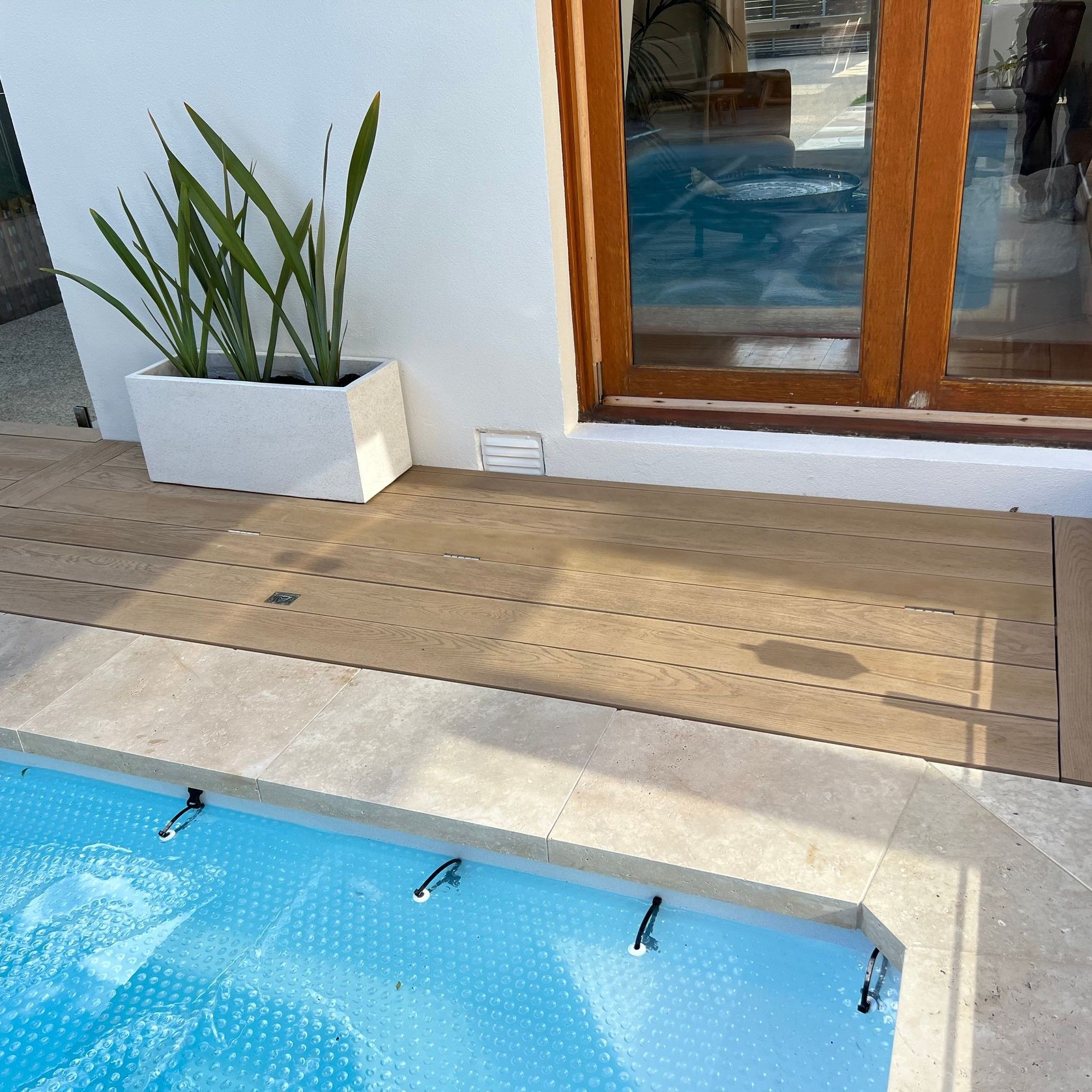Under Deck UnderCover® Concealed Pool Cover - Powered | ArchiPro AU