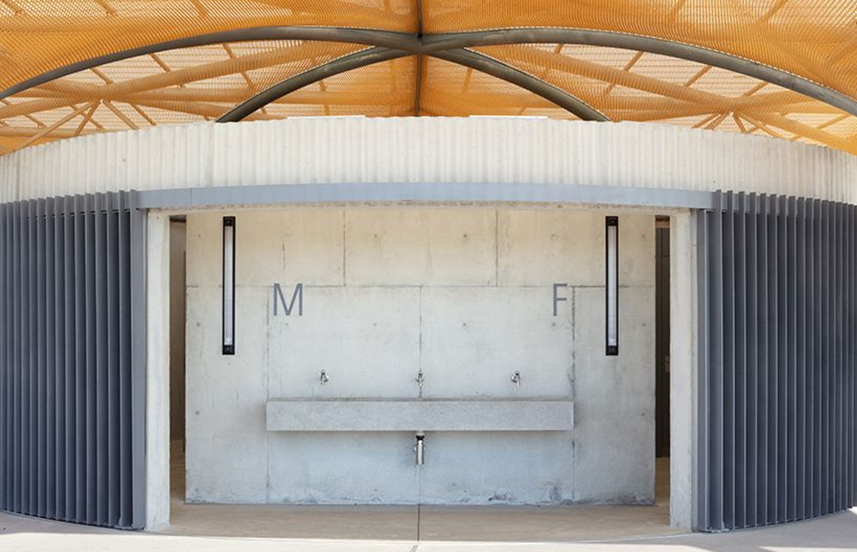 Golden Mesh Shades a Sports Pavilion in Sydney | ArchiPro AU