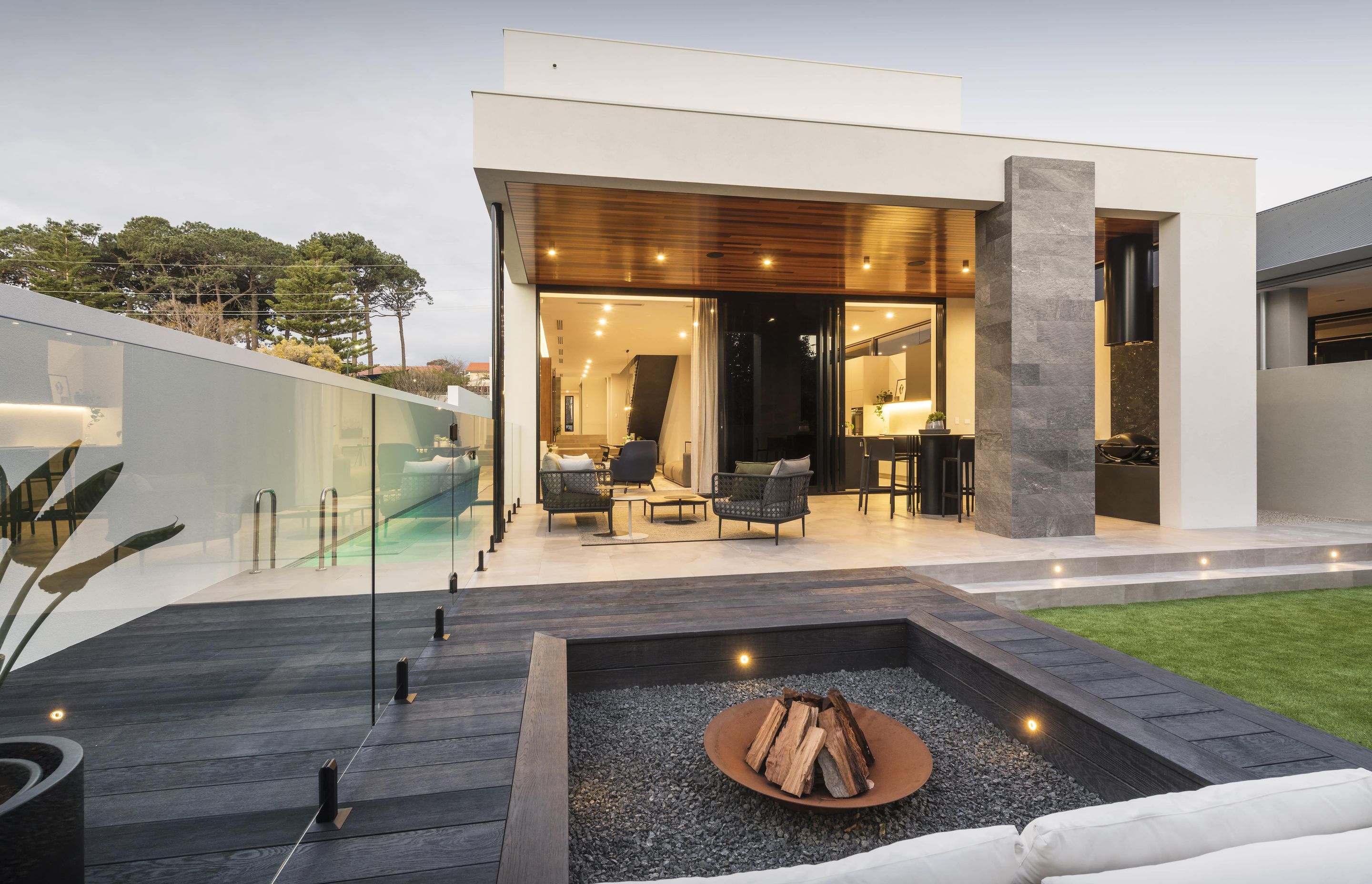 Backyard Fire pit featuring Burnt Cedar with lap pool